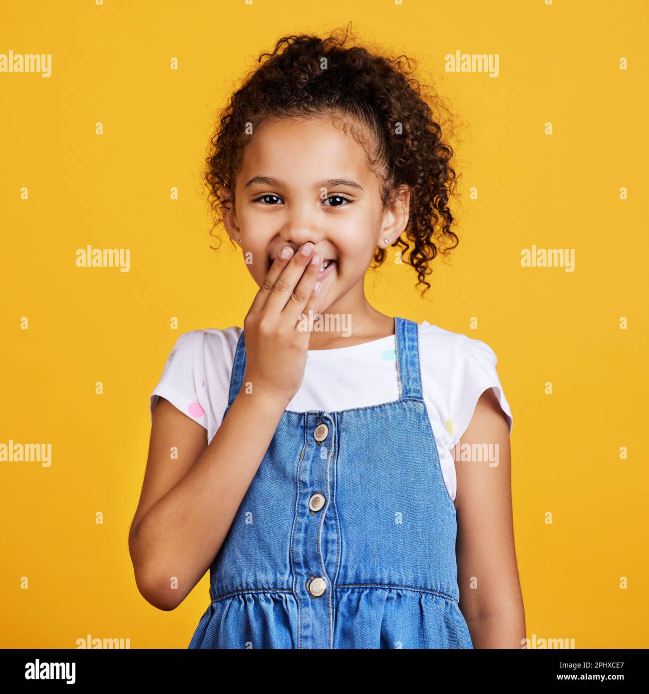 Laughing, happy and portrait of a child in a studio with a comic funny ...