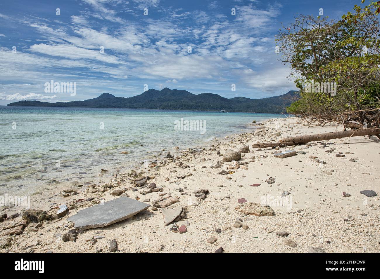 An idyllic white sand beach of tiny Mantigue Island near Camiguin in ...