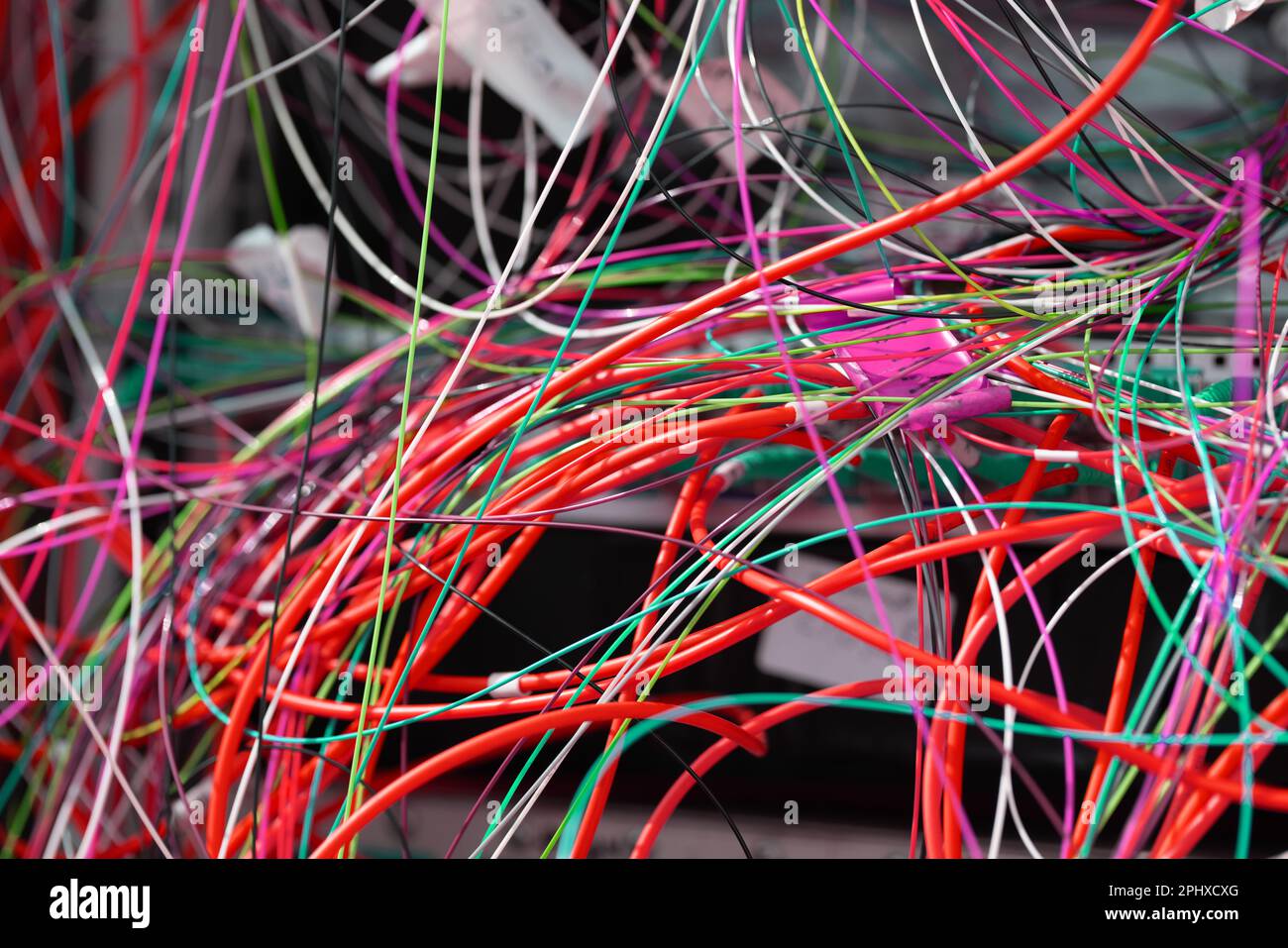 Tangled wires in electrical cabinet. Electric and mains wires are ...