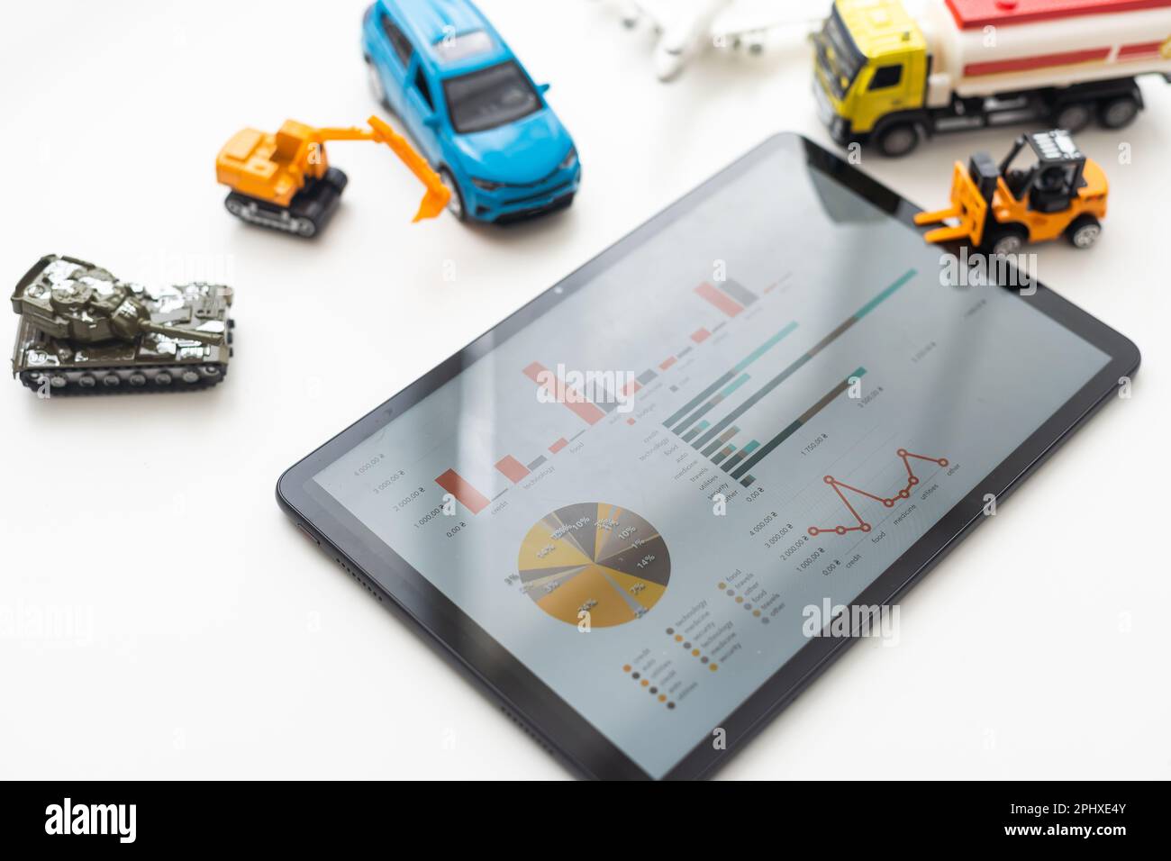 Tablet computer with different types of toy transport Stock Photo - Alamy