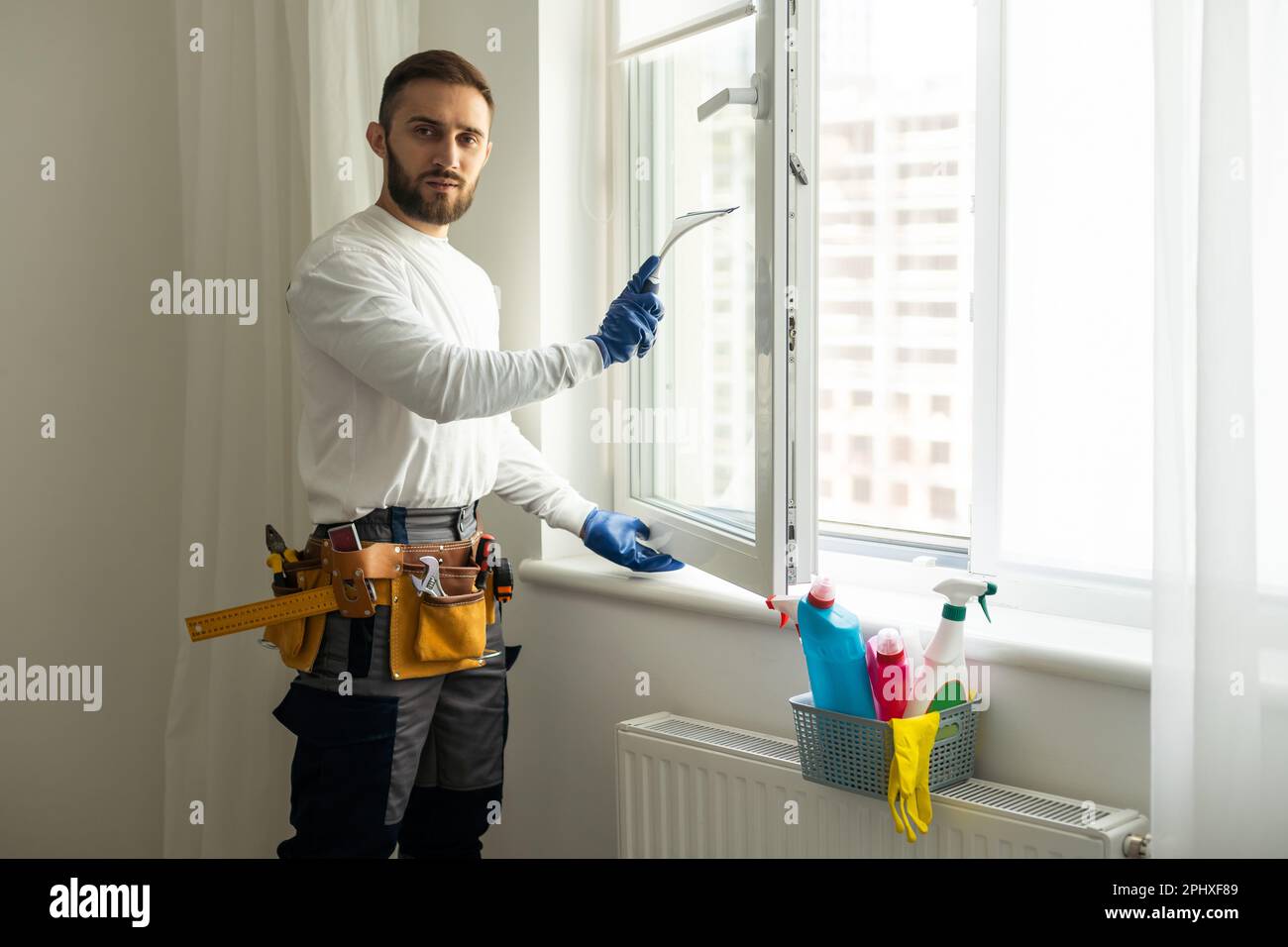 Professional cleaning, man washes window Stock Photo - Alamy
