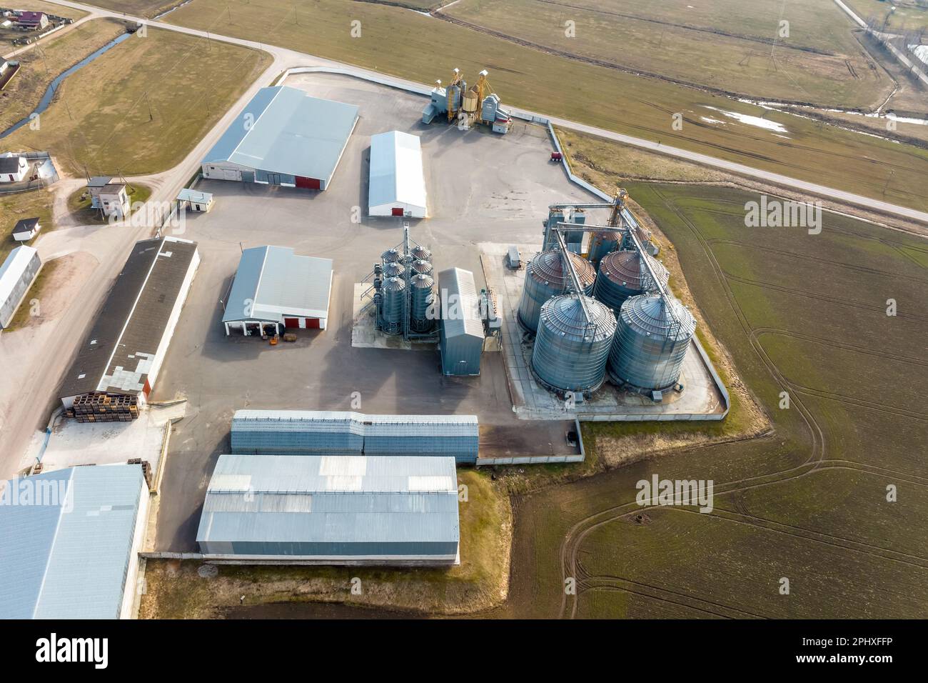 aerial panoramic view on agro-industrial complex with silos and grain ...