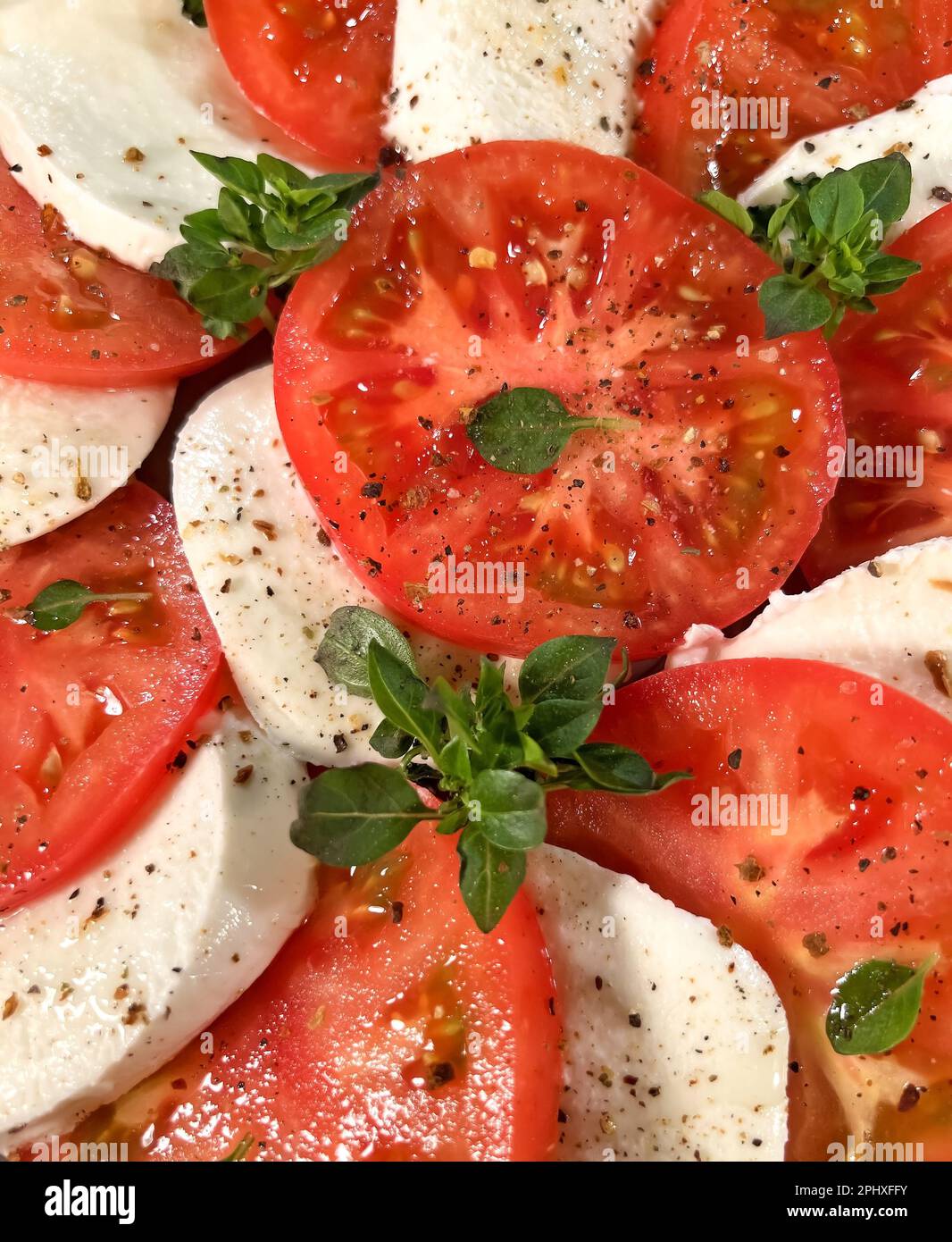Tomato and mozzarella Caprese salad with sauce Stock Photo - Alamy