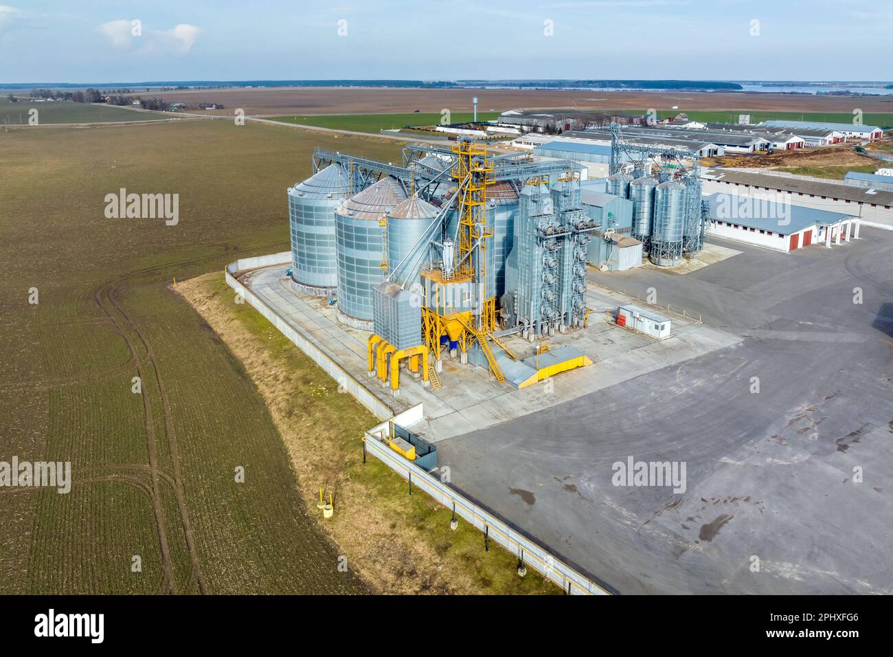 aerial panoramic view on agro-industrial complex with silos and grain ...