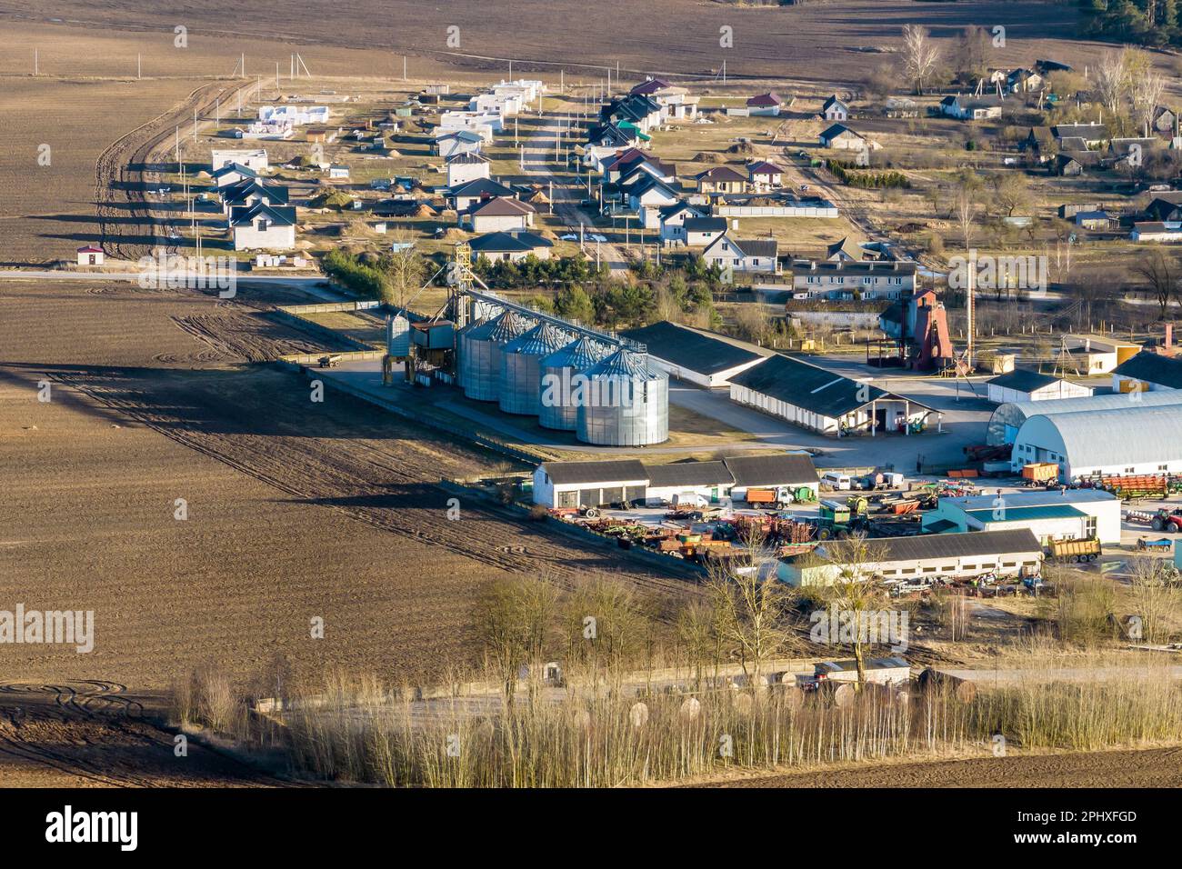 aerial panoramic view on agro-industrial complex with silos and grain ...