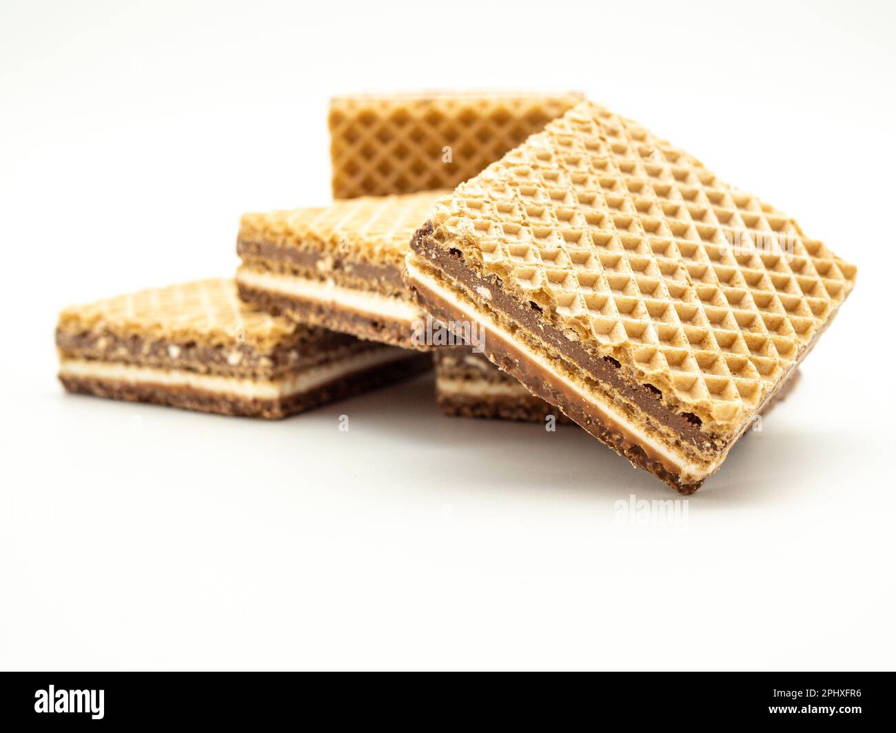 delicious hazelnut cream filled wafers on white background Stock Photo ...