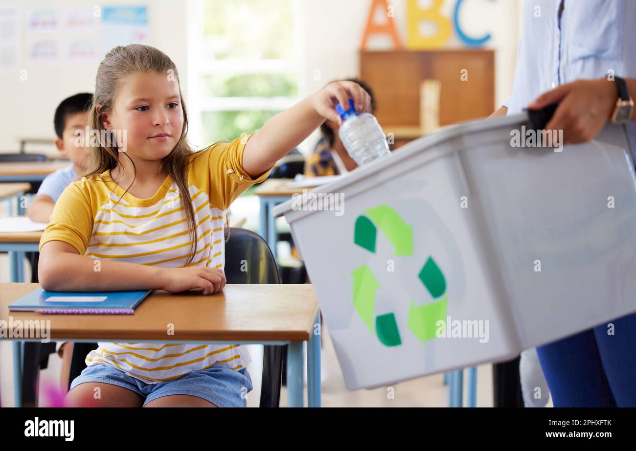 Child, classroom and recycling plastic bottle with teacher for ecology ...