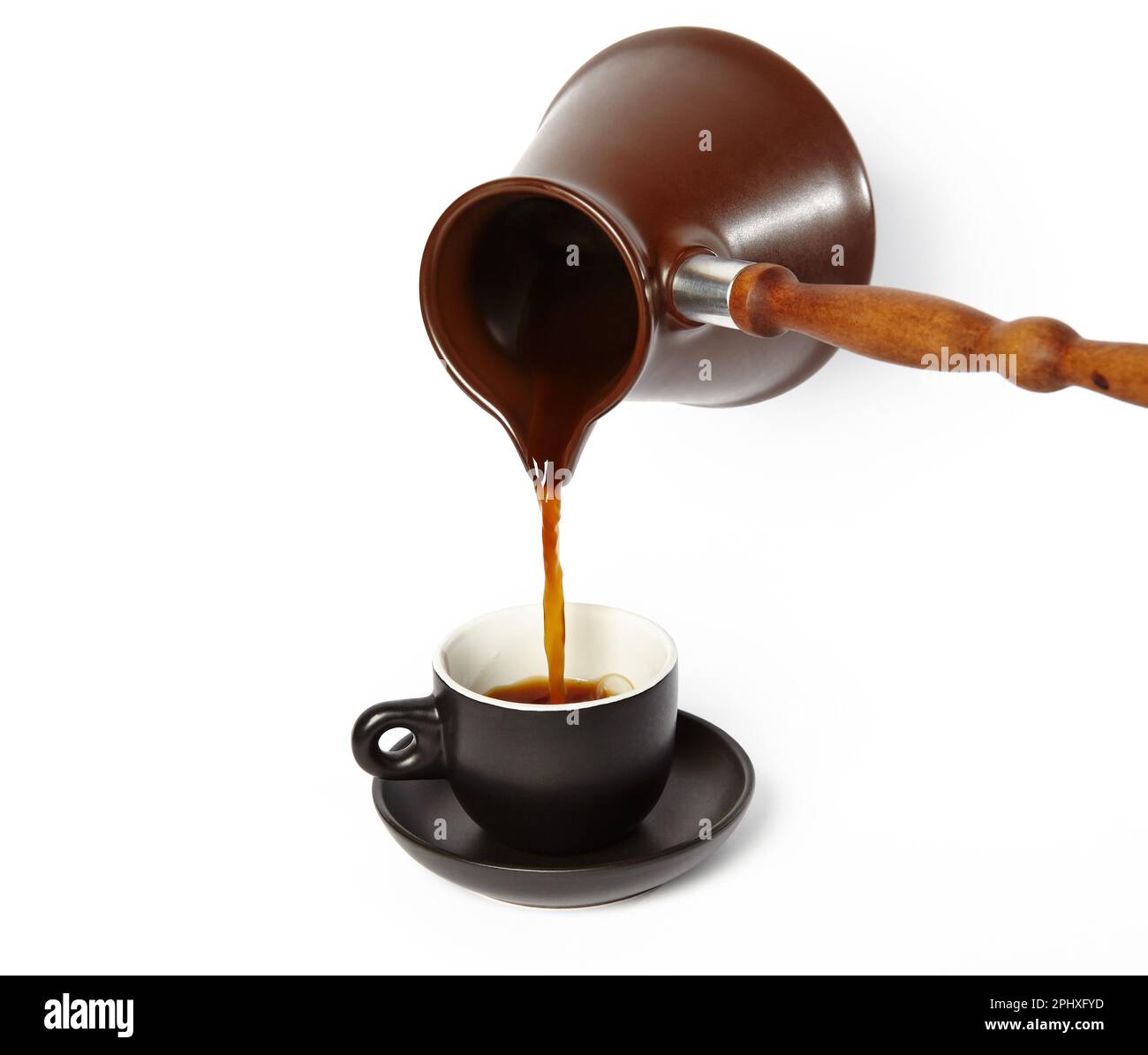 Man pouring coffee into cup isolated white background. Clay cezve for ...