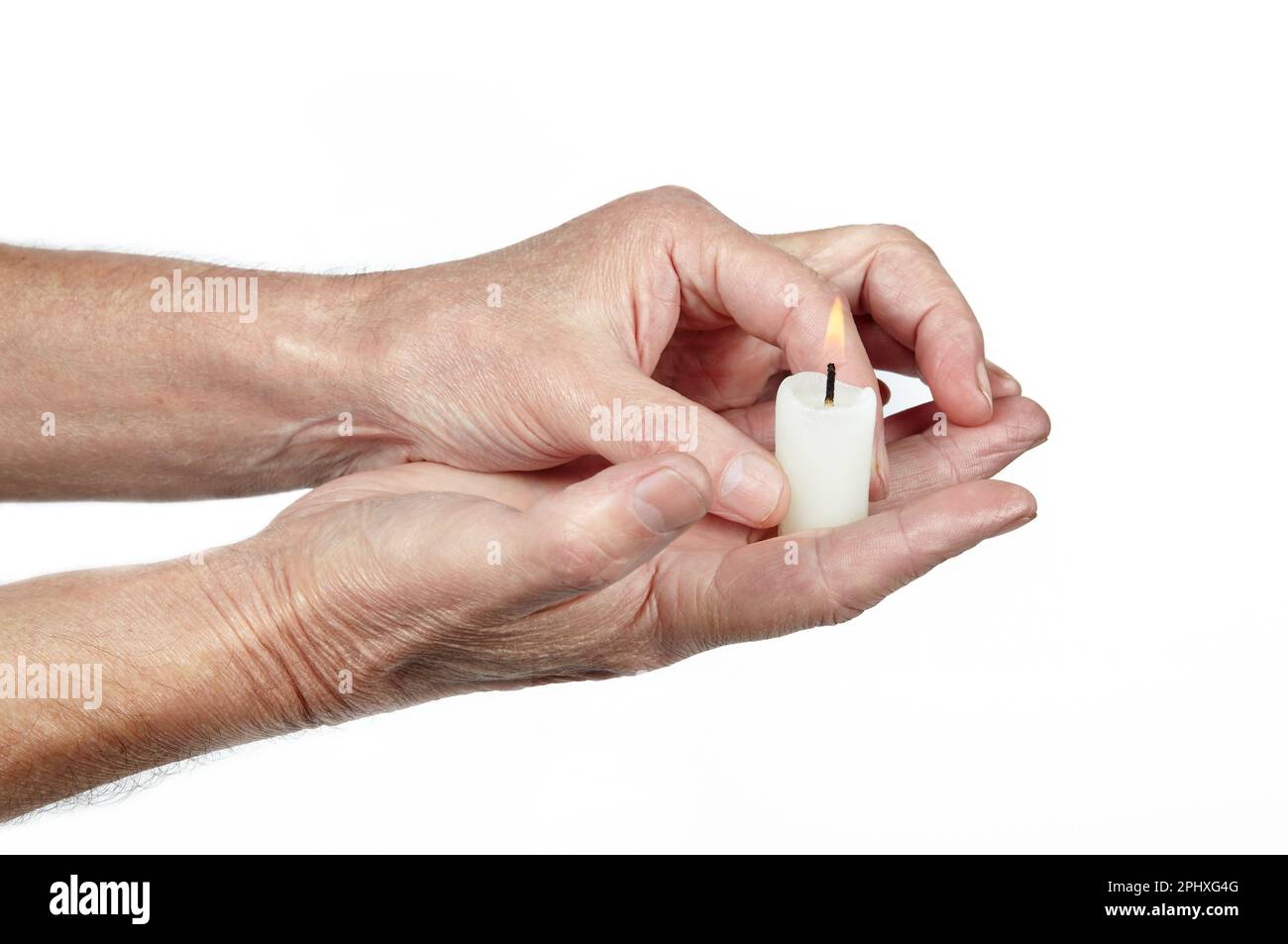 Men's hands holding a candle isolated white background. Man holding ...