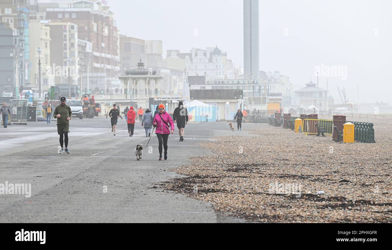Brighton UK 30th March 2023 - Walkers on Hove seafront early this ...