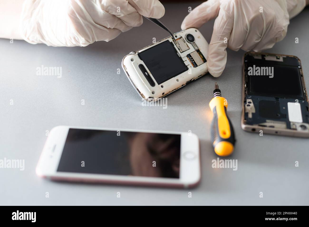 Close-up photos showing process of mobile phone repair Stock Photo - Alamy