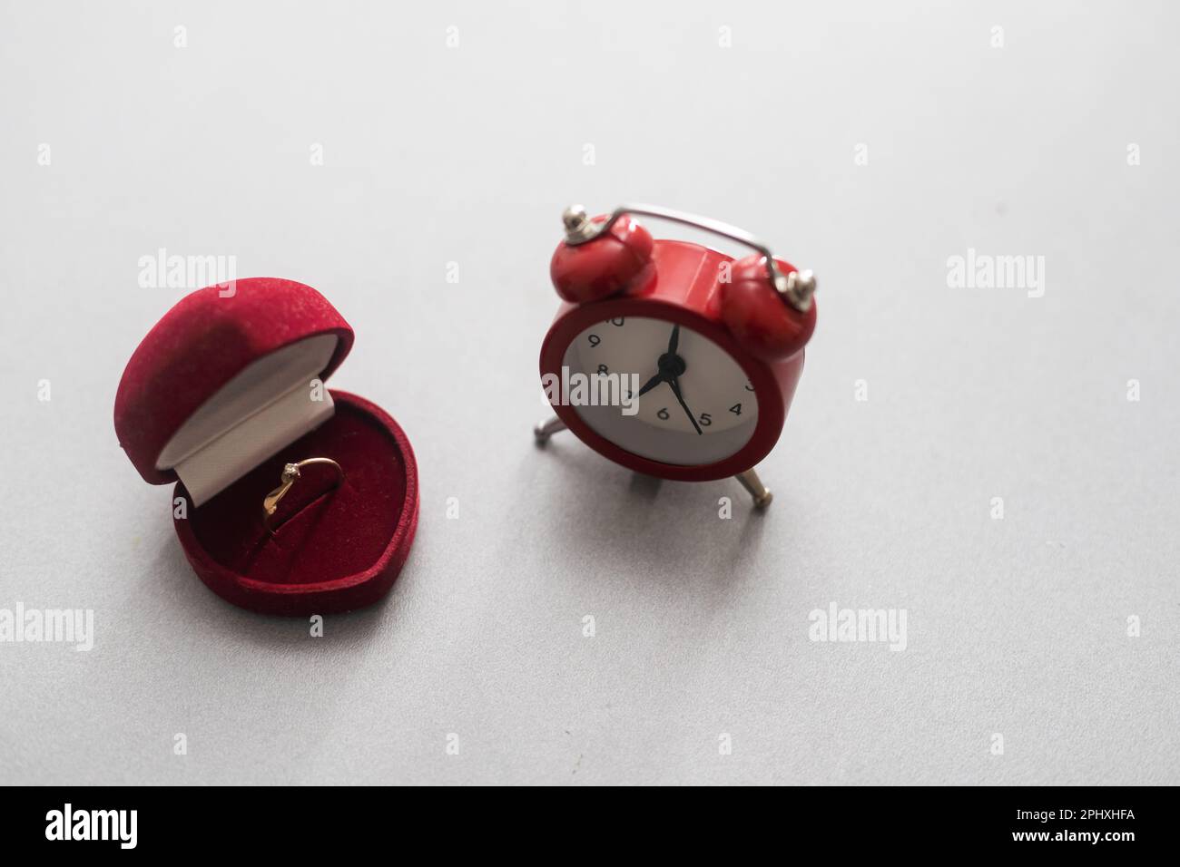 Wedding rings alarm clock hi-res stock photography and images - Alamy