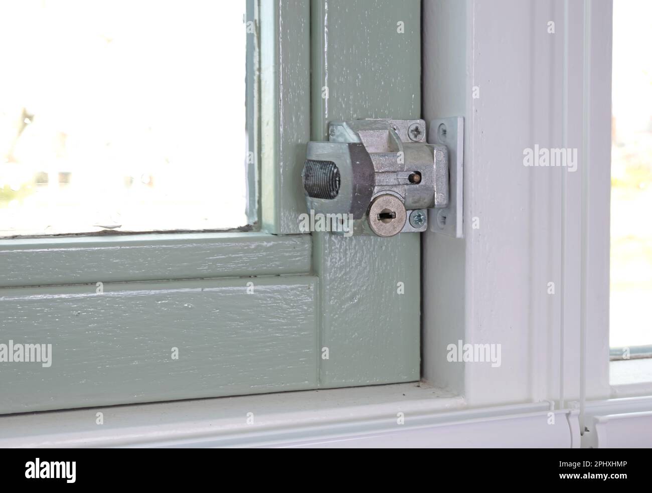 Simple lock on the inside of a window, selective focus Stock Photo - Alamy