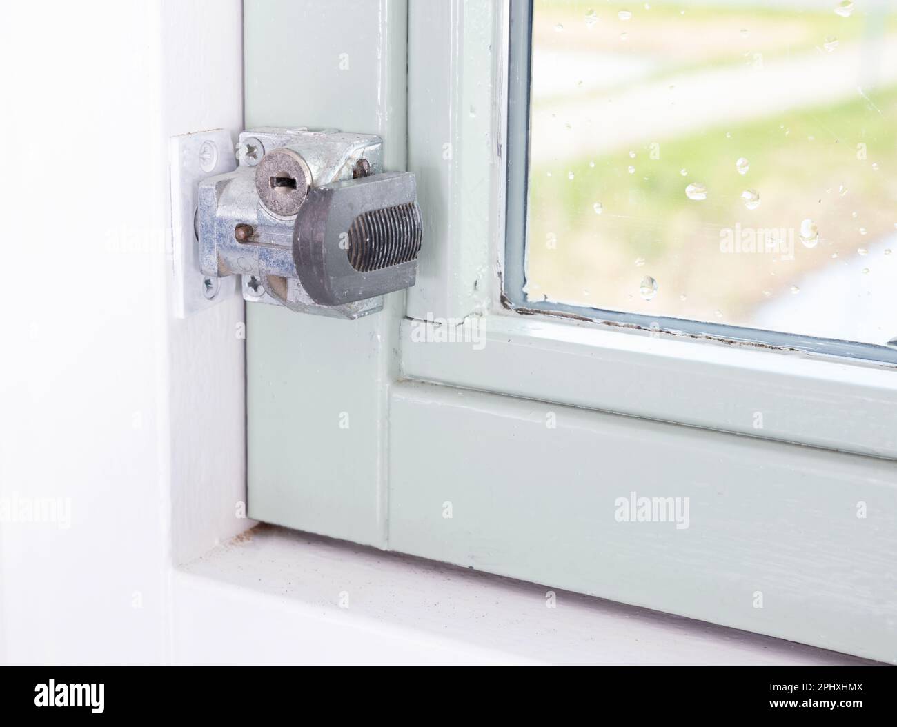 Simple lock on the inside of a window, selective focus Stock Photo - Alamy