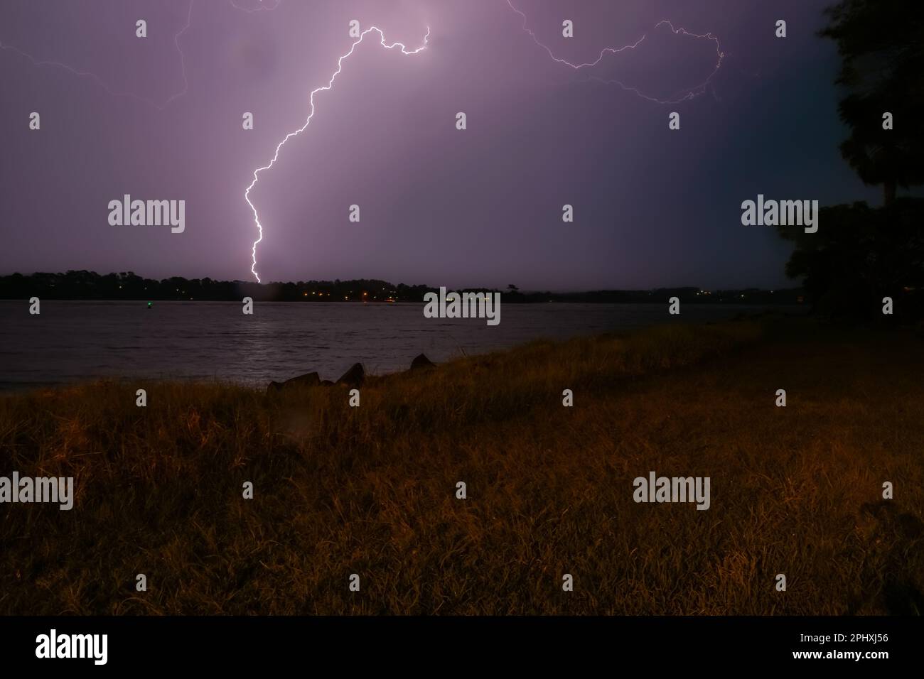 Bright lightning flash illuminates sky across Bateman's Bay, Australia ...