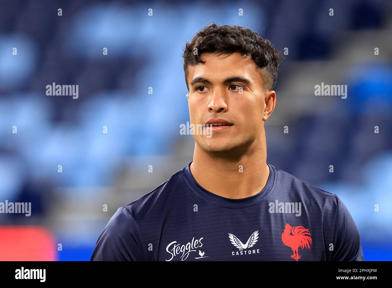 Joseph Suaalii of the Roosters looks on during the warm up ahead of the ...