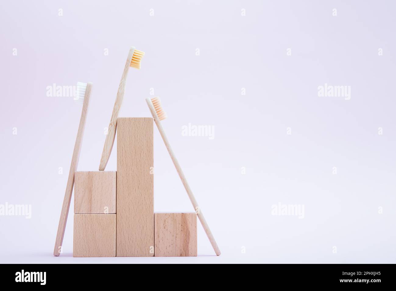 Composition of bamboo toothbrushes and wooden podium blocks. The ...
