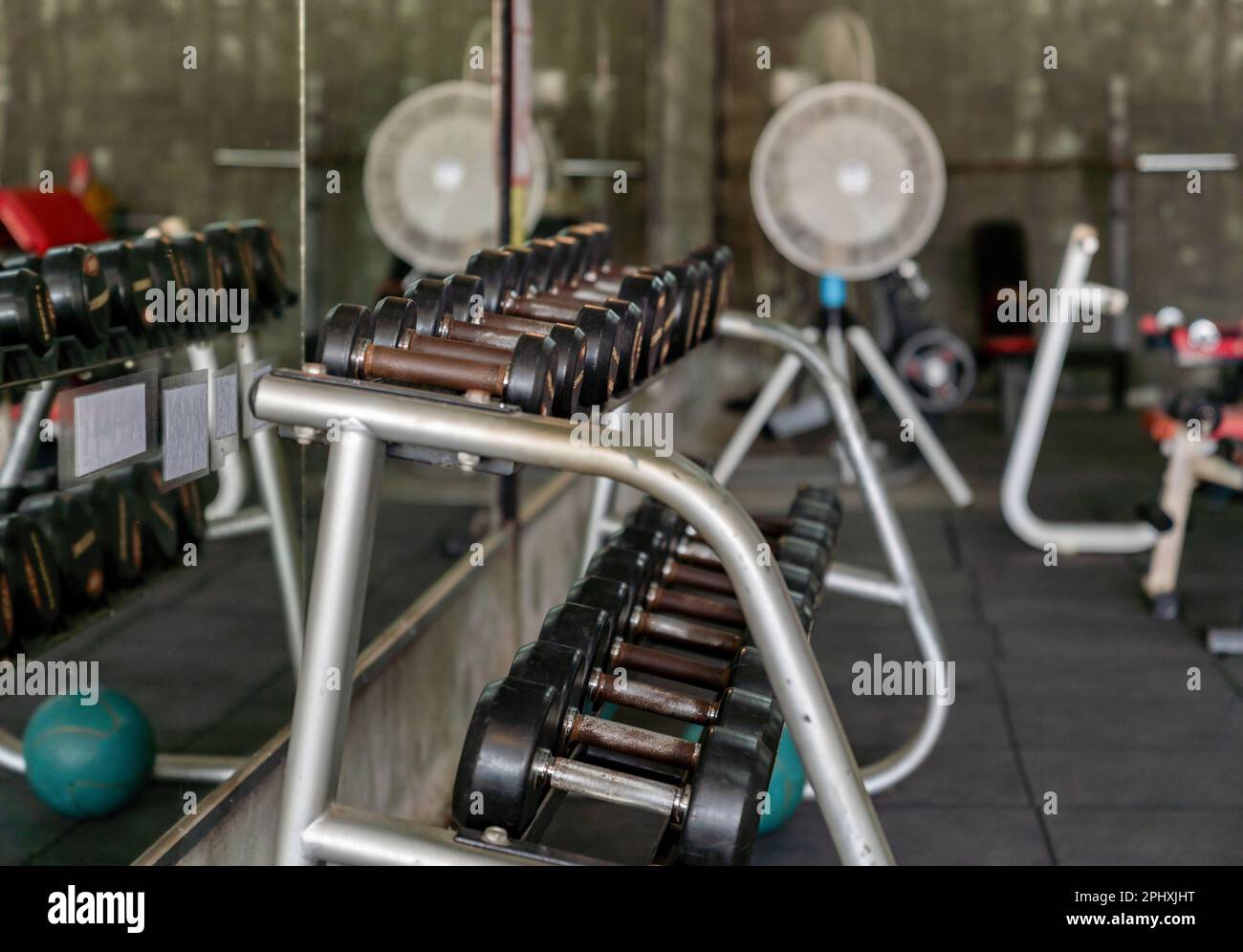 Dumbbell stack in gym Stock Photo - Alamy