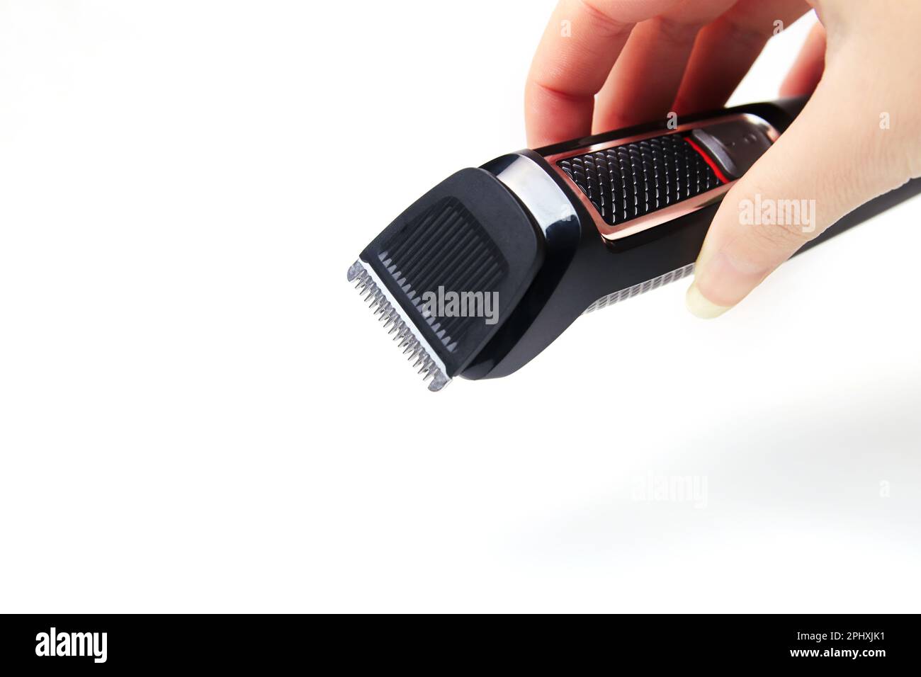 Professional hair clipper isolated on white background. Defocus female ...