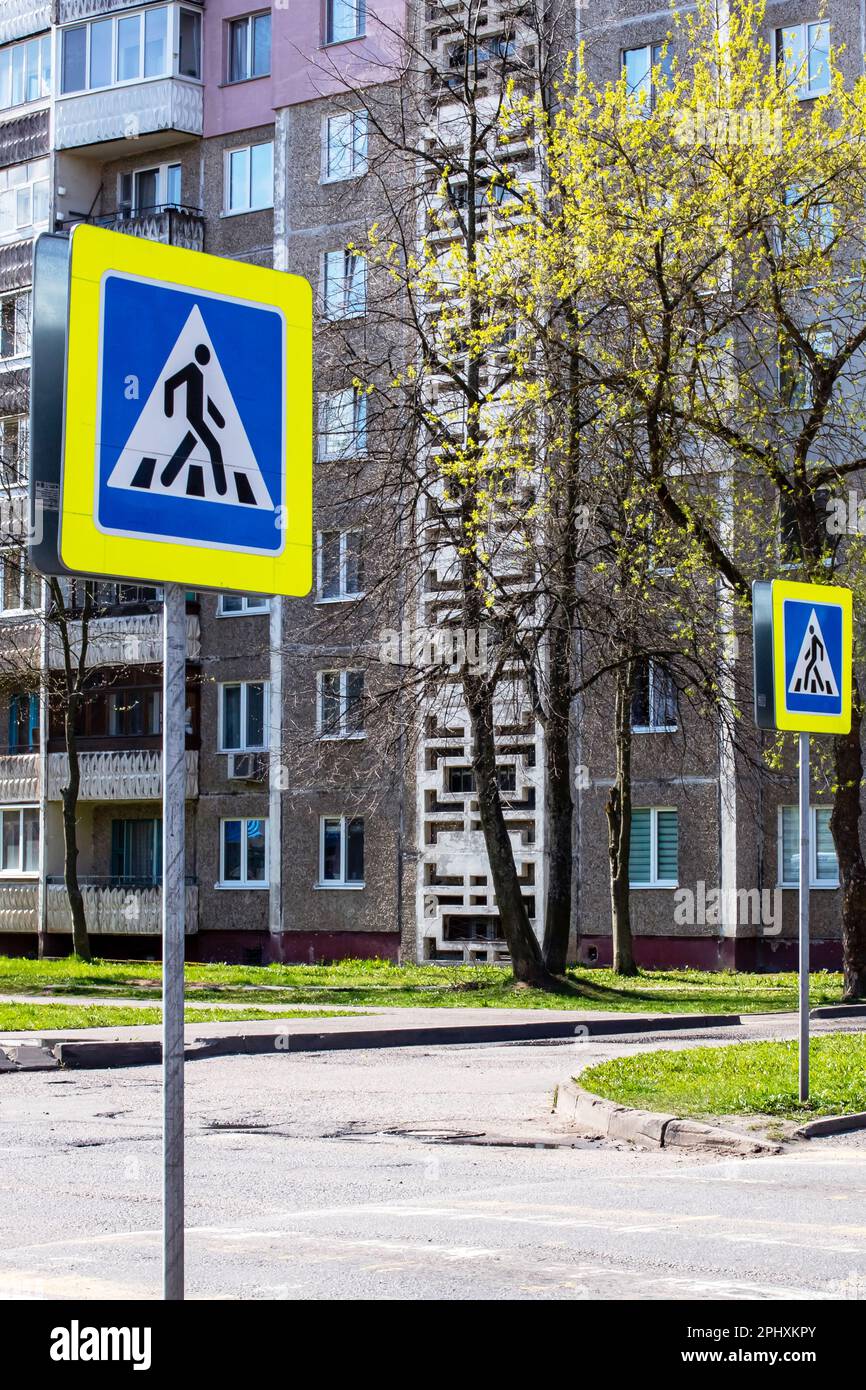 Blue crosswalk signs in the city in summer Stock Photo - Alamy