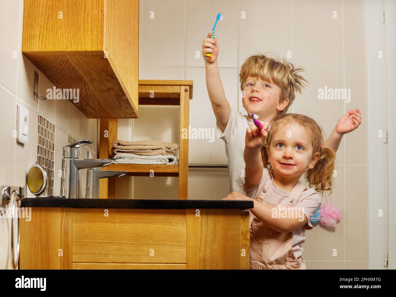 Two sibling kids brother and sister with toothbrush in hands Stock ...
