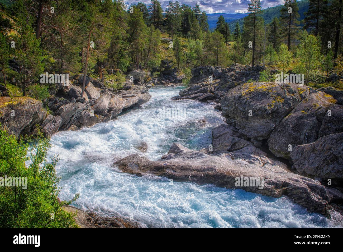 river with brave waters running down a mountain in Norway Stock Photo ...