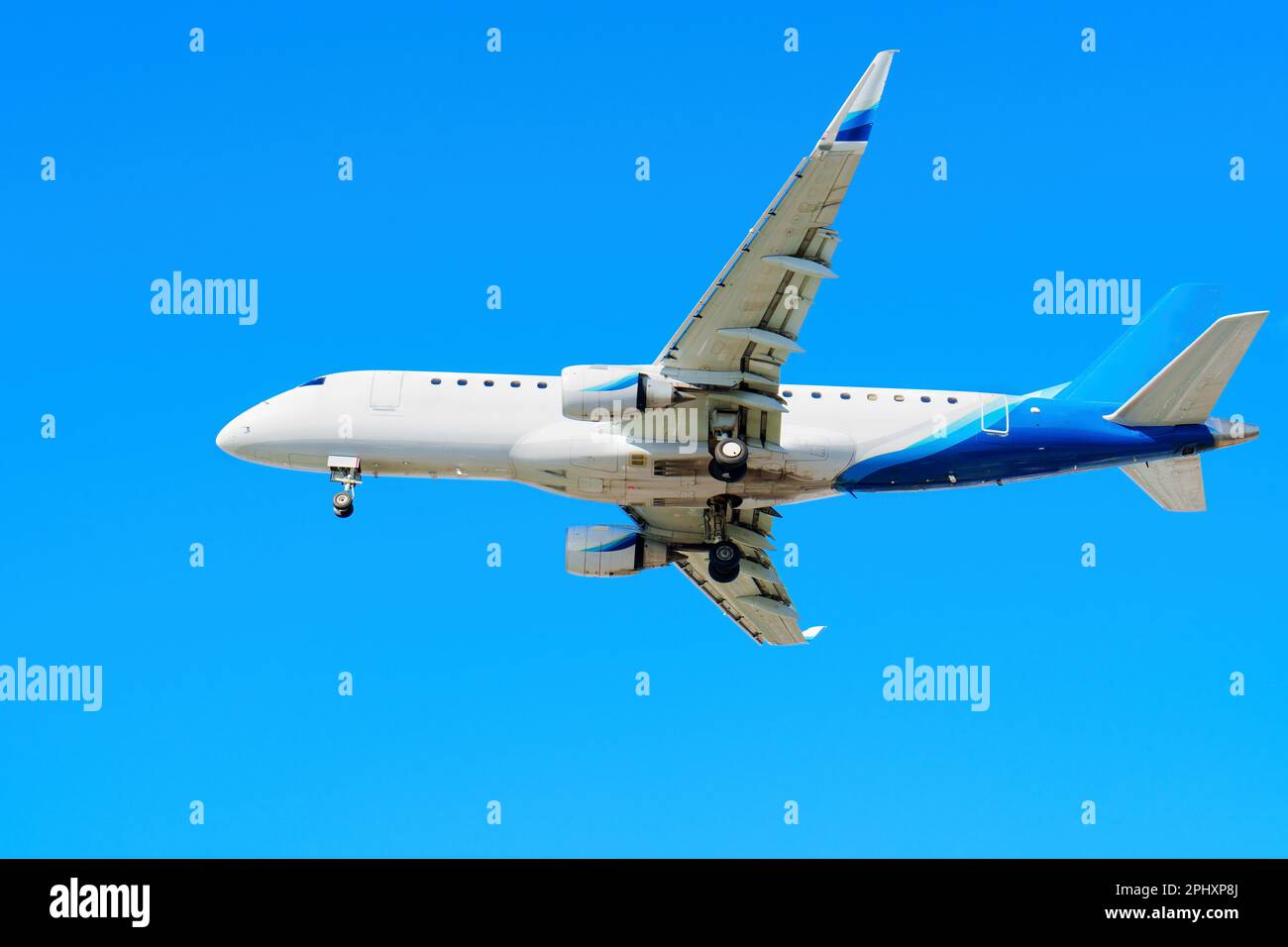 Close-up side view of a plane as it comes in for landing against the ...