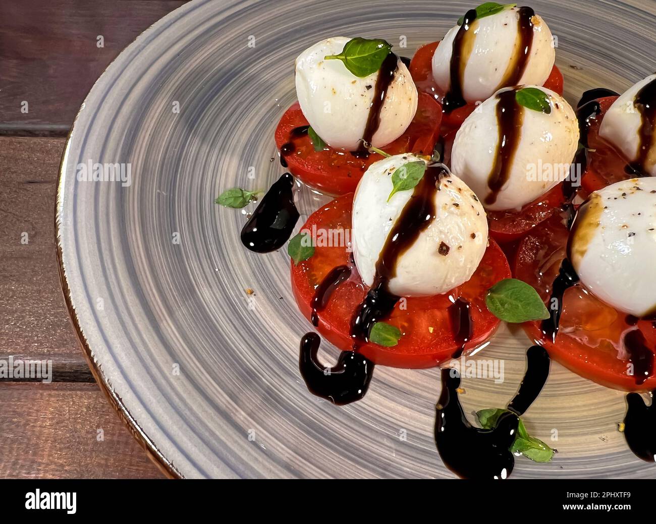 Tomato and mozzarella Caprese salad with sauce Stock Photo - Alamy