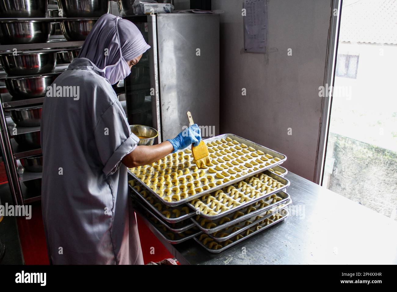 Bandung, West Java, Indonesia. 30th Mar, 2023. Workers make cookies in ...