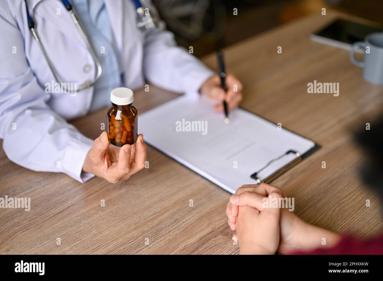 Close-up image of a professional female doctor explaining and giving ...