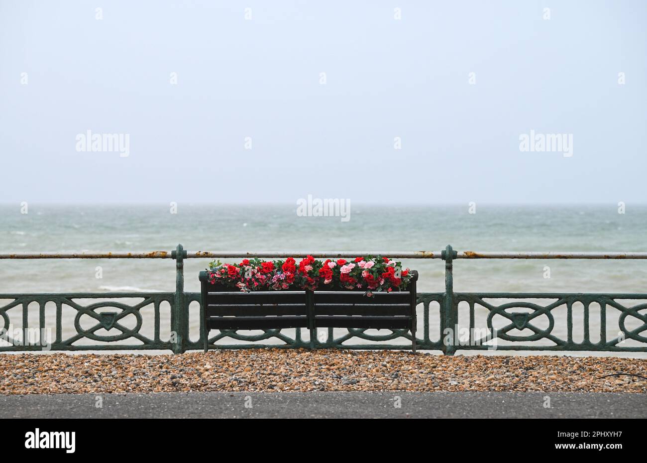 A memorial bench on Hove seafront has been decorated with flowers ...