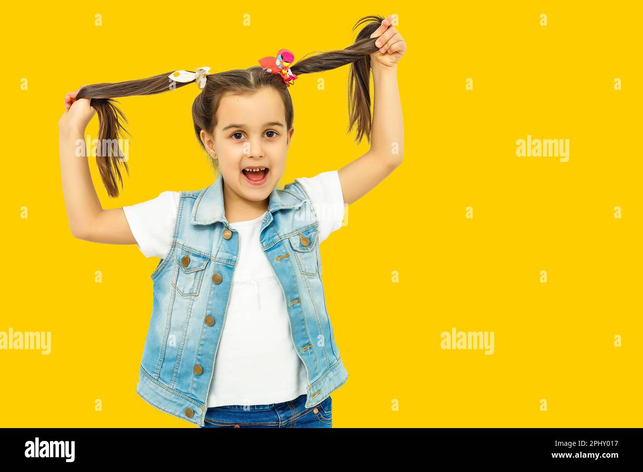 Happy Five Year Old Girl In Bright Joy Over Yellow Background Happy happy-five-year-old-girl-in-bright-joy-over-yellow-background-happy