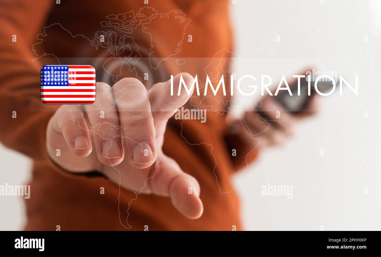 Man pointing at word IMMIGRATION and world map on dark blue background ...