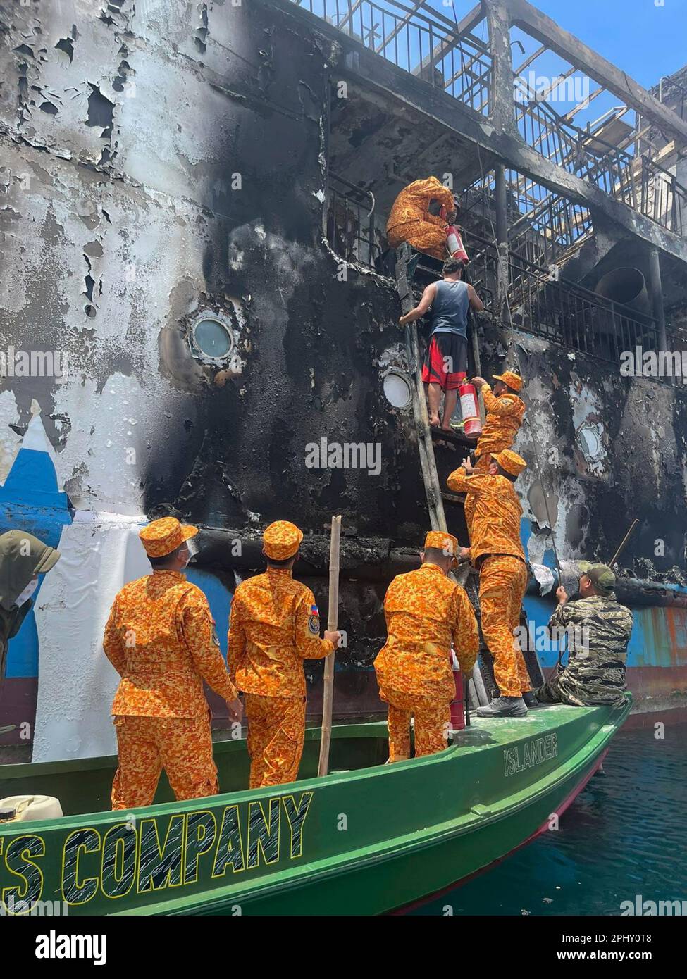 In this handout photo provided by the Philippine Coast Guard (PCG), PCG ...