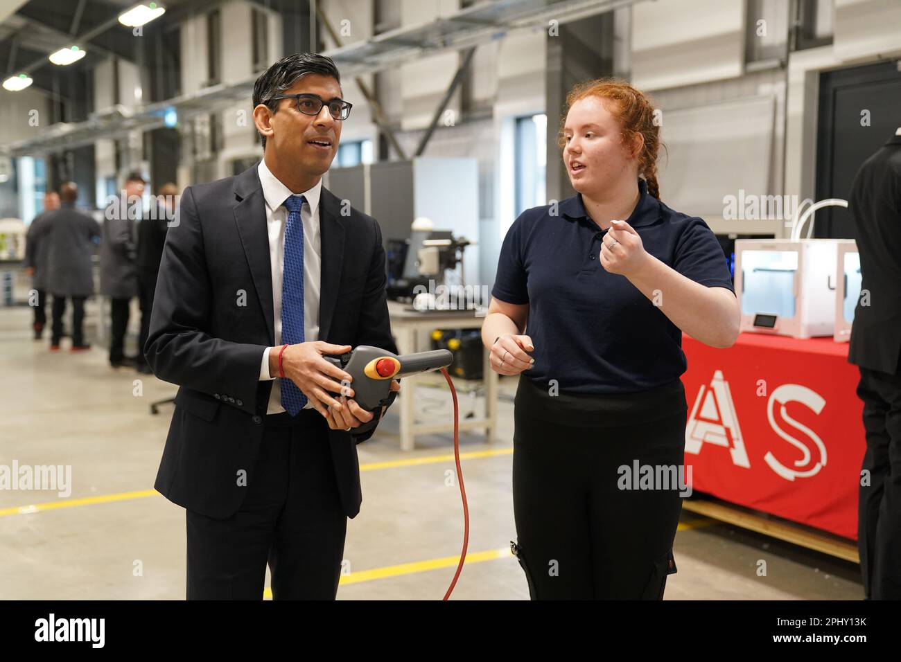 Prime Minister Rishi Sunak is shown robotics by an apprentice during a ...