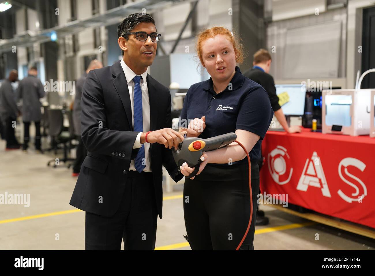 Prime Minister Rishi Sunak is shown robotics by an apprentice during a ...