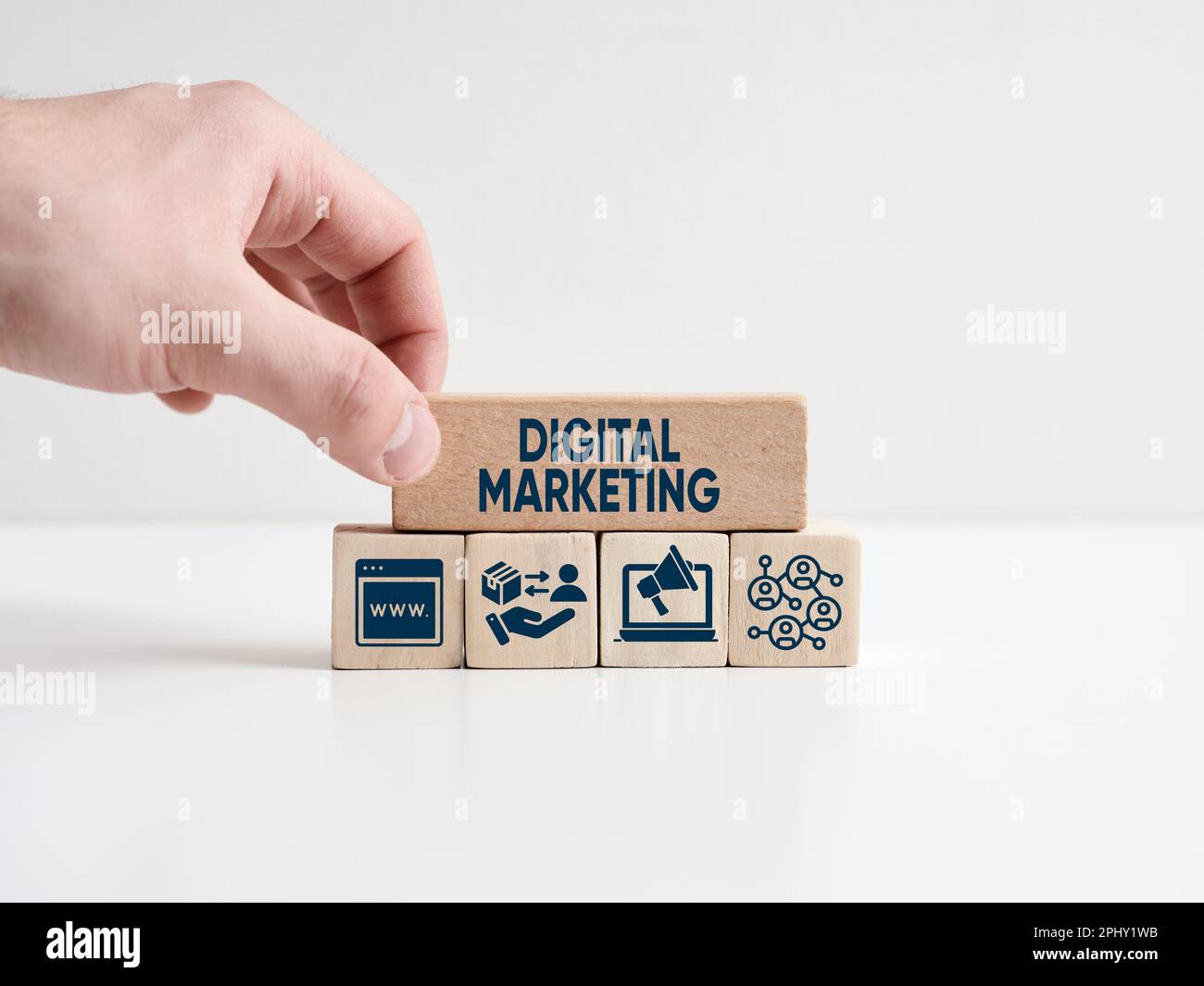 Digital marketing concept. Hand places wooden block with the word ...