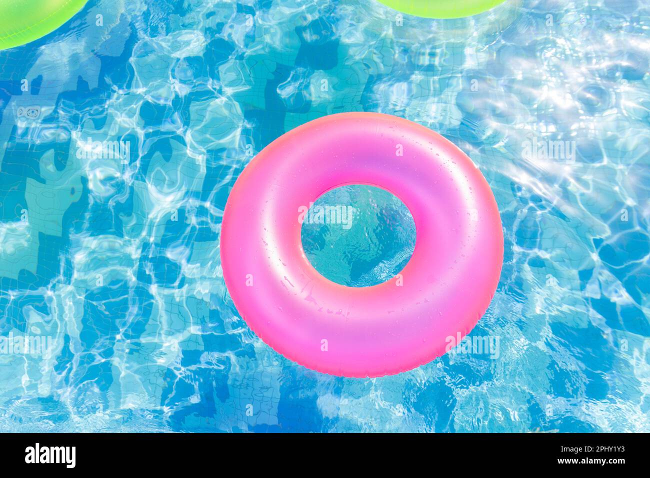 Inflatable Swimming Ring floating in the pool Stock Photo - Alamy
