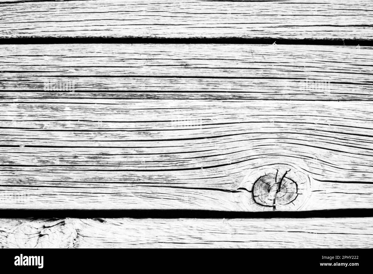 Black and white aged pine wood boards. Horizontal photo with one wooden board with round sign of ...
