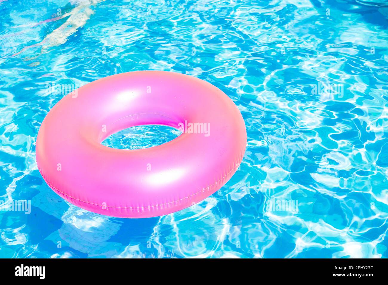 Inflatable Swimming Ring floating in the pool Stock Photo - Alamy