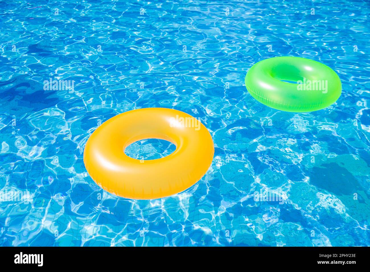 Inflatable Swimming Ring floating in the pool Stock Photo - Alamy