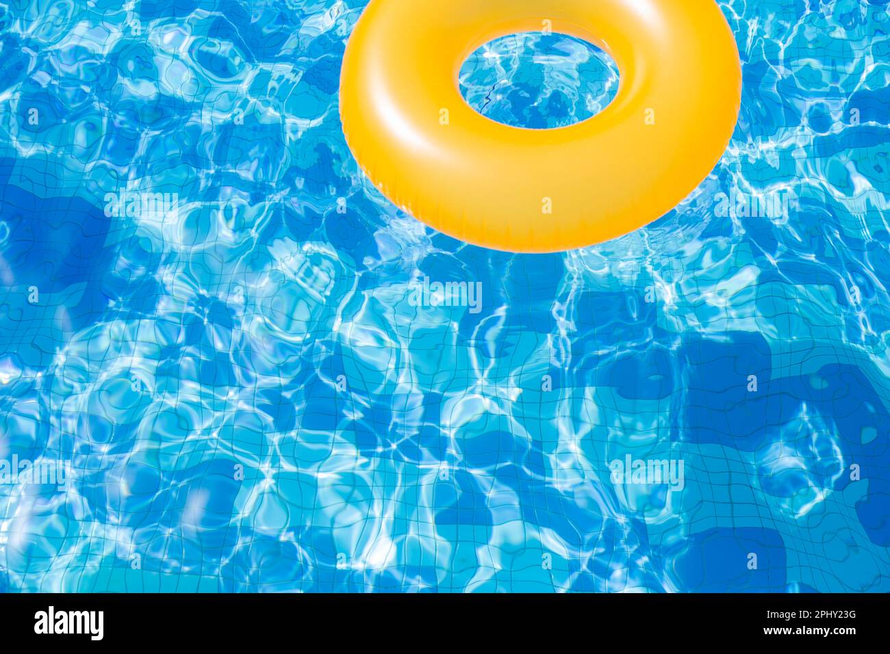 Inflatable Swimming Ring floating in the pool Stock Photo - Alamy