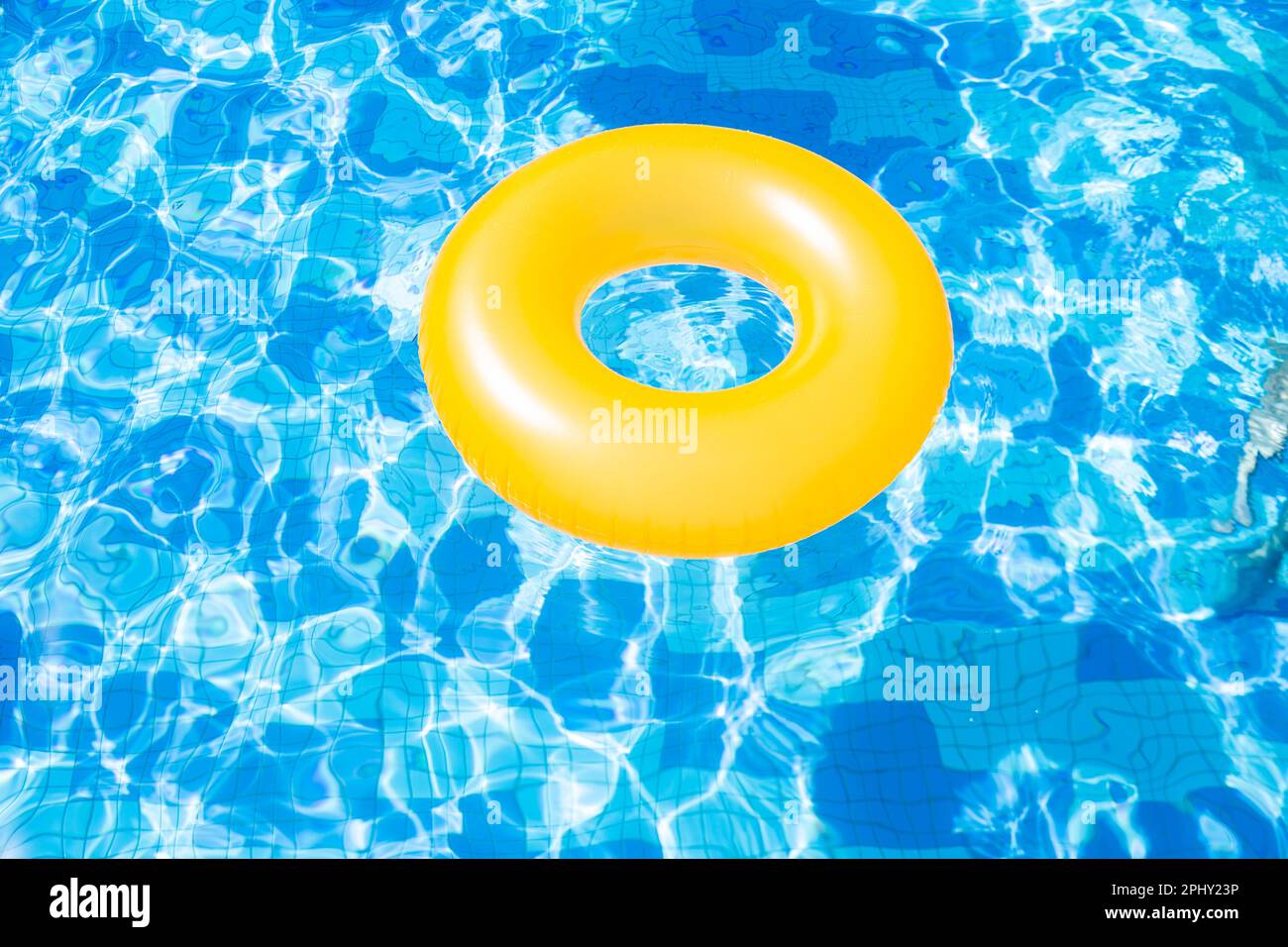Inflatable Swimming Ring floating in the pool Stock Photo - Alamy