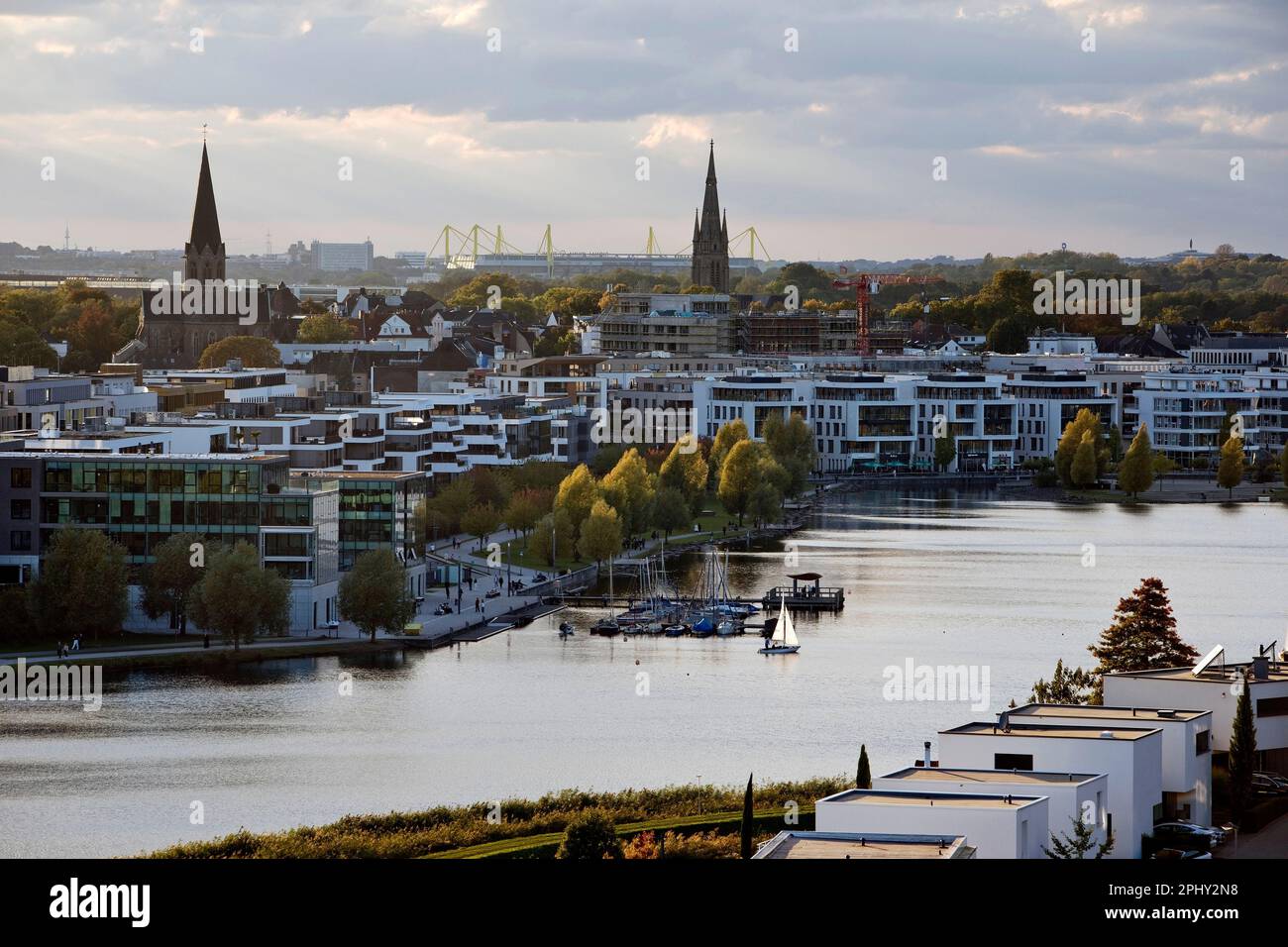 Residential development at Lake Phoenix with the city skyline in the ...
