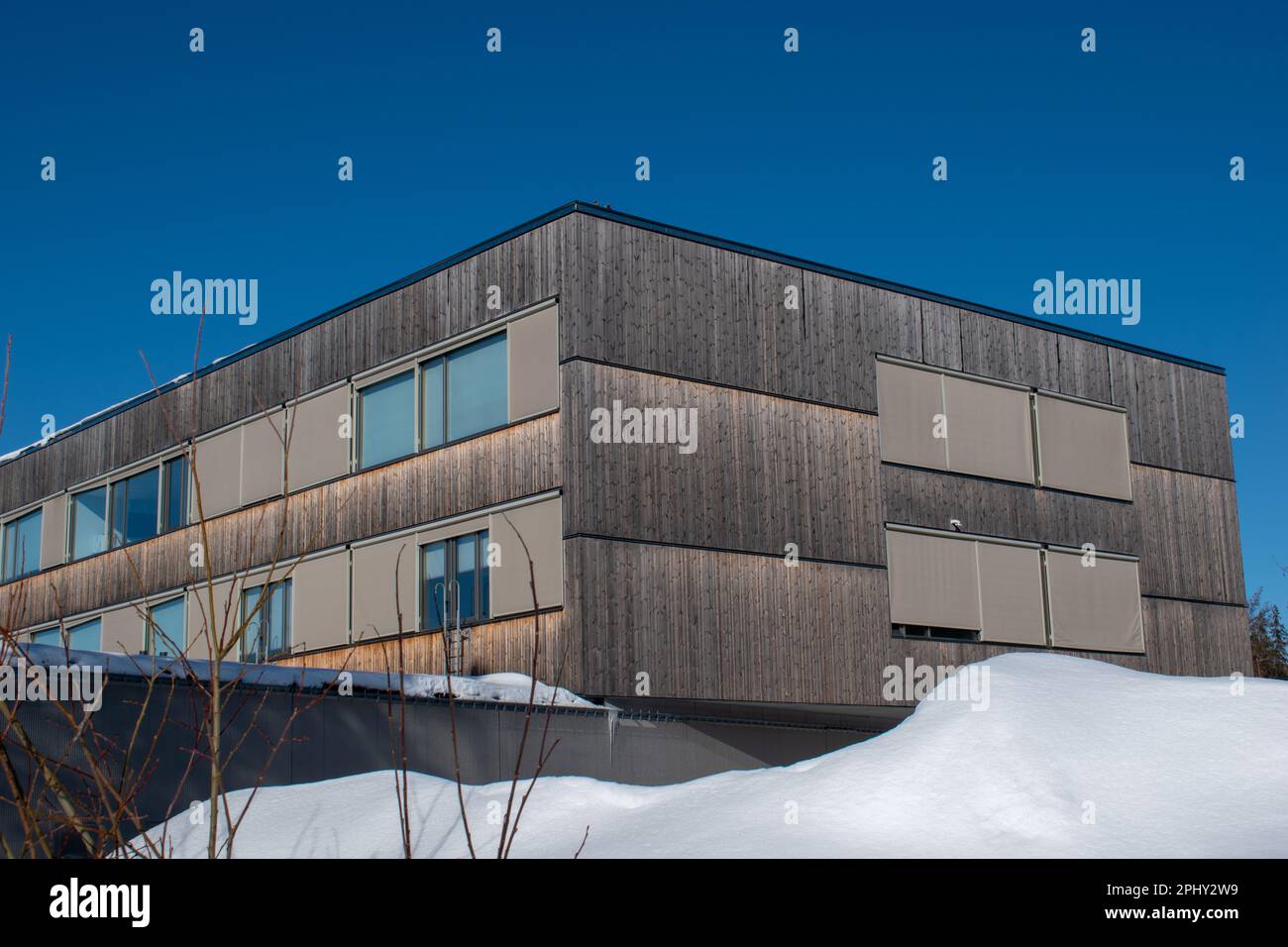 Modern contemporary wood sided building. Taken in a winter scene in the ...