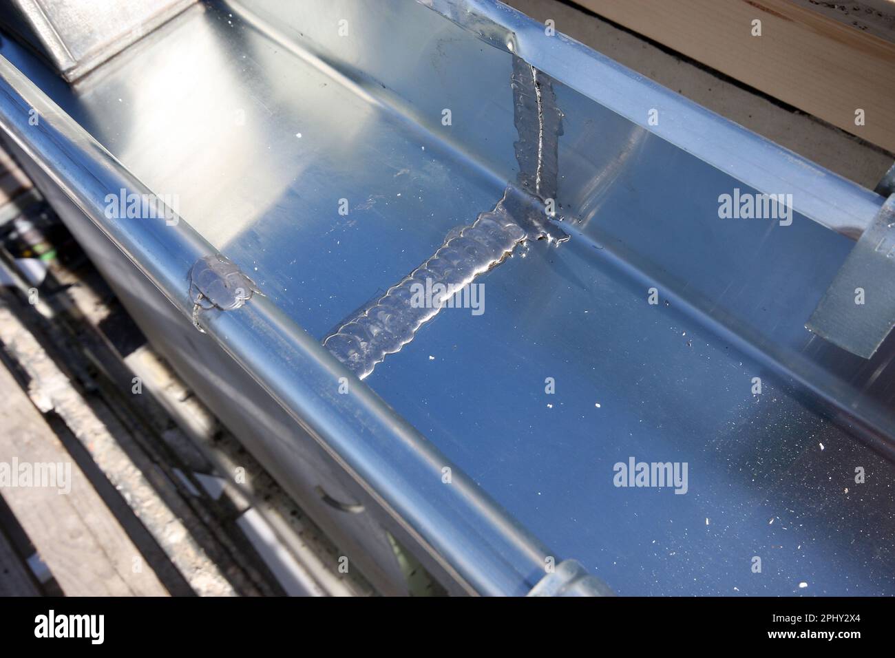 gutter connections are soldered Stock Photo - Alamy