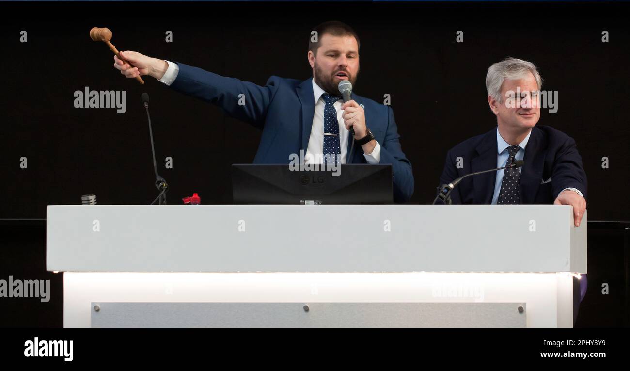 Close-up of Mathew Priddy and Edward Rising on the rostrum, during a ...