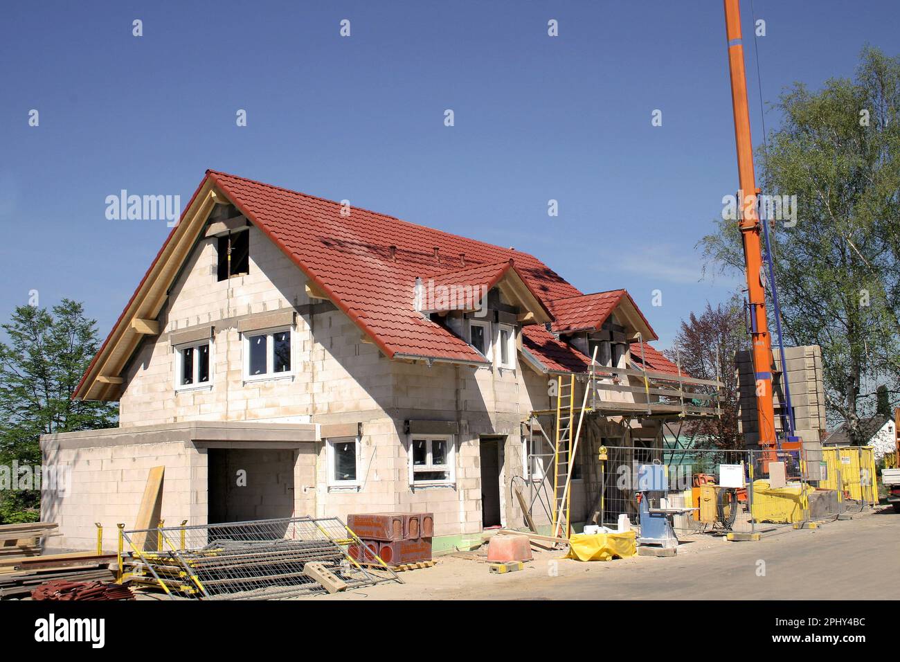 newly built house and almost finished house Stock Photo - Alamy