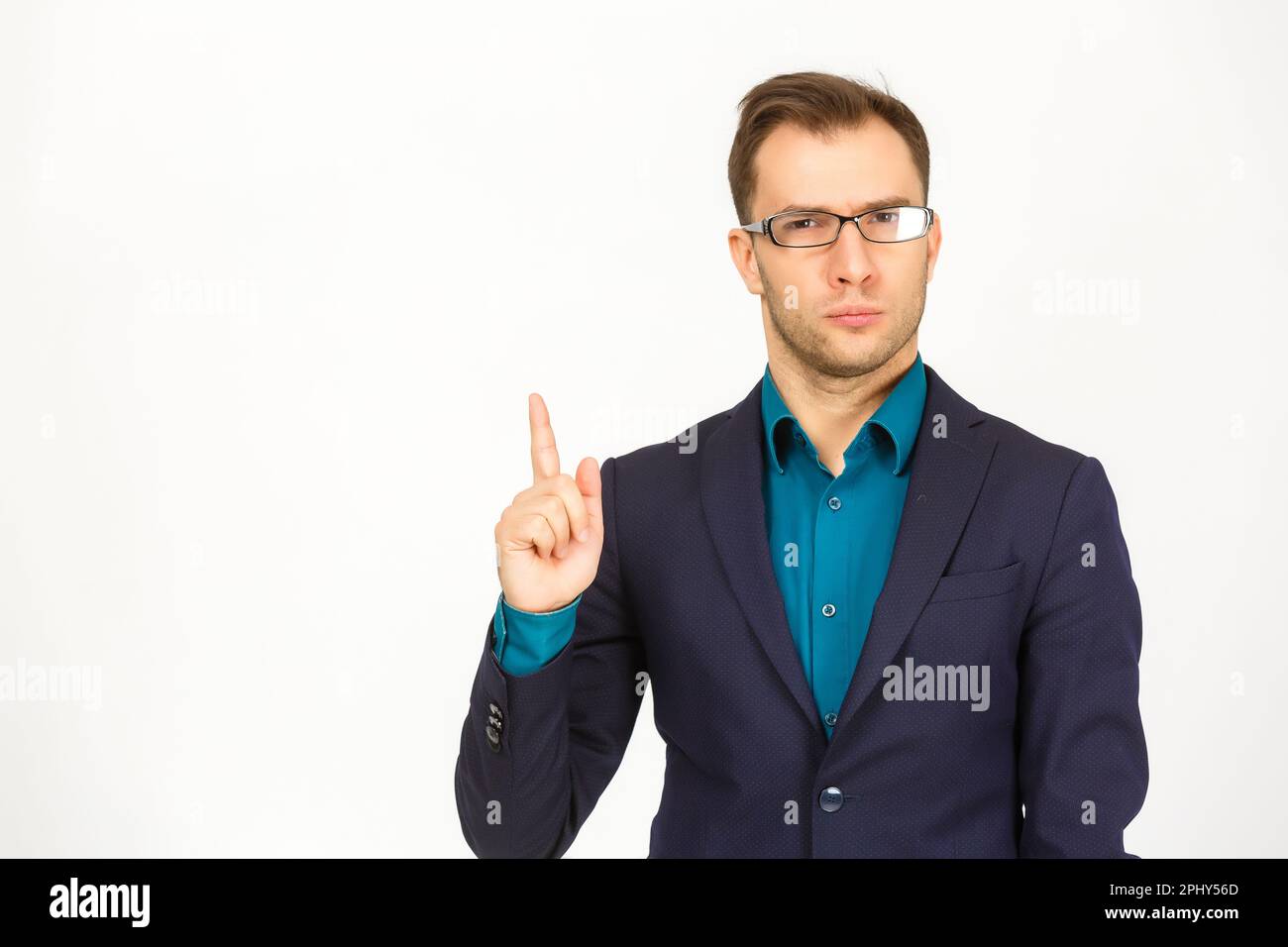 Man standing and presenting something above against white background ...