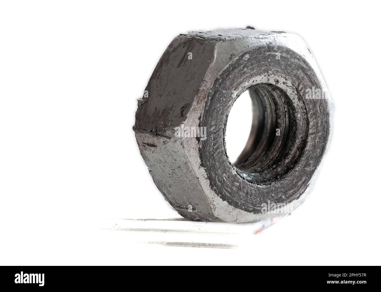 macro photography of a worn nut, side view 45 degrees, in gray tones ...